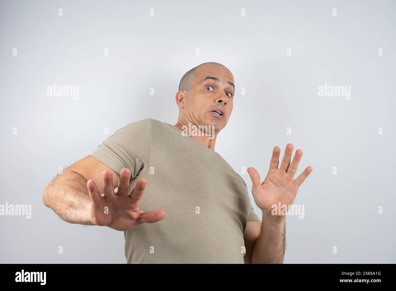 Caucasian, Brazilian man, 48 years old, in the studio showing emotions ...