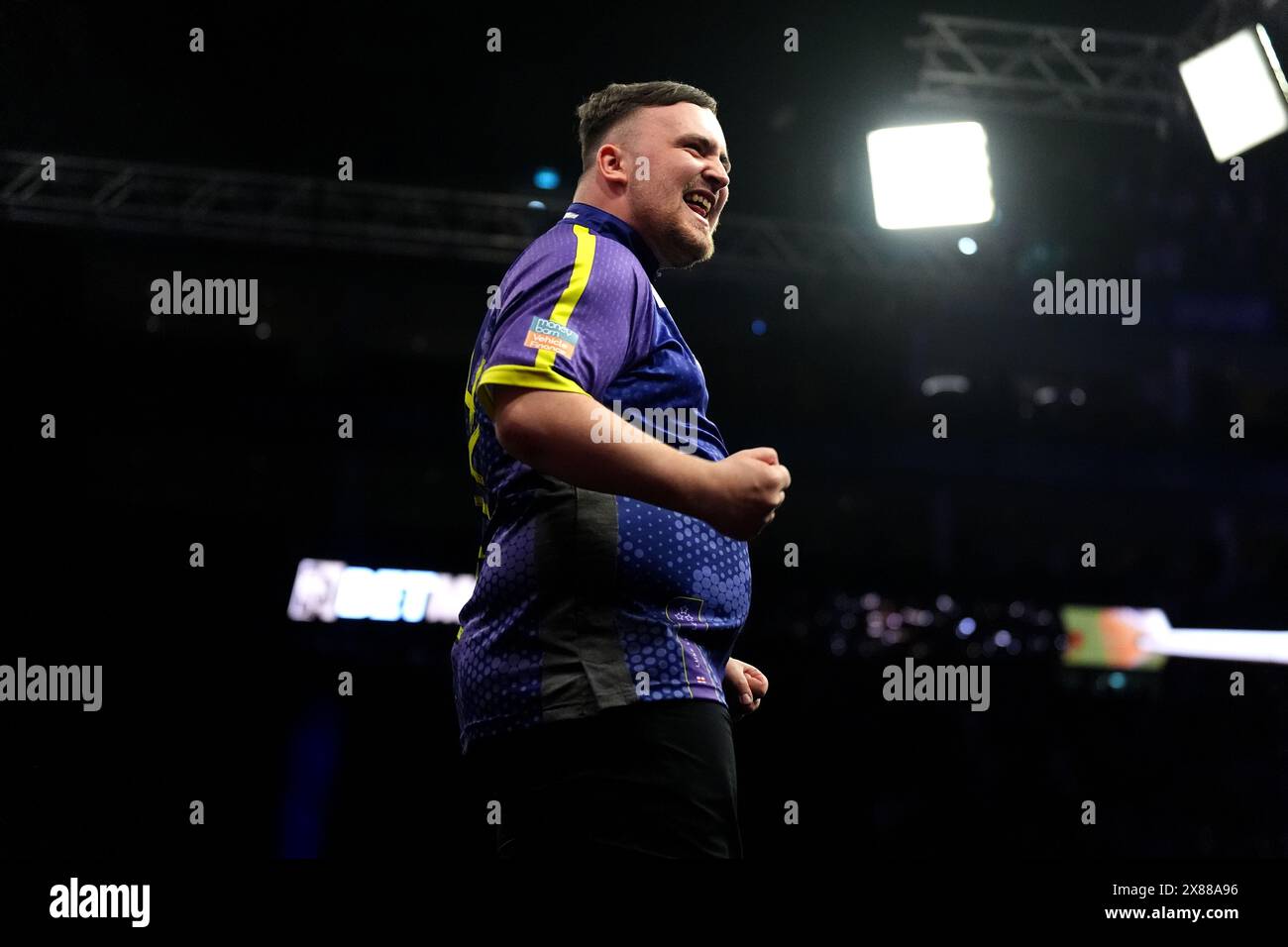 Luke Littler reacts after hitting a nine-darter during the final ...