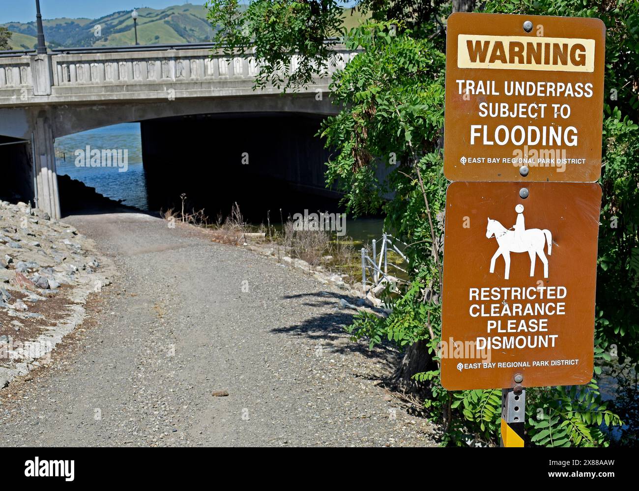 restricted clearance please dismount and flooding warning signs for ...