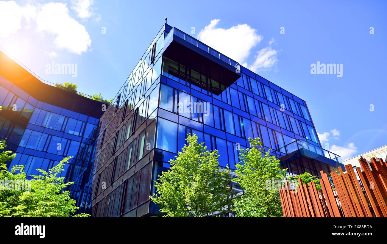 Sustainable glass office building with trees for reducing carbon ...
