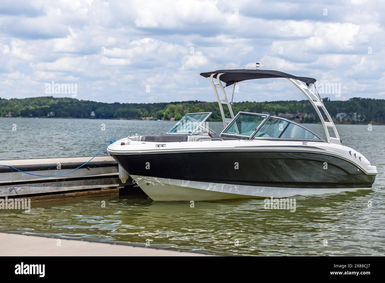 Powerboat at private boat dock on freshwater lake Stock Photo - Alamy