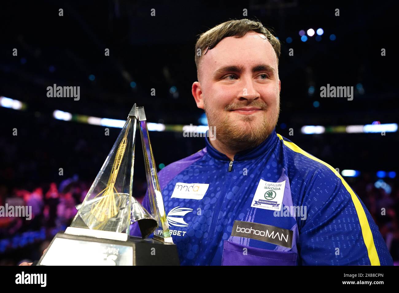 Luke Littler celebrates with the trophy after victory in the final ...