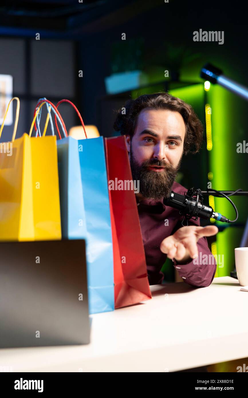 Content creator filming fashion vlog, unboxing bags with internet order ...