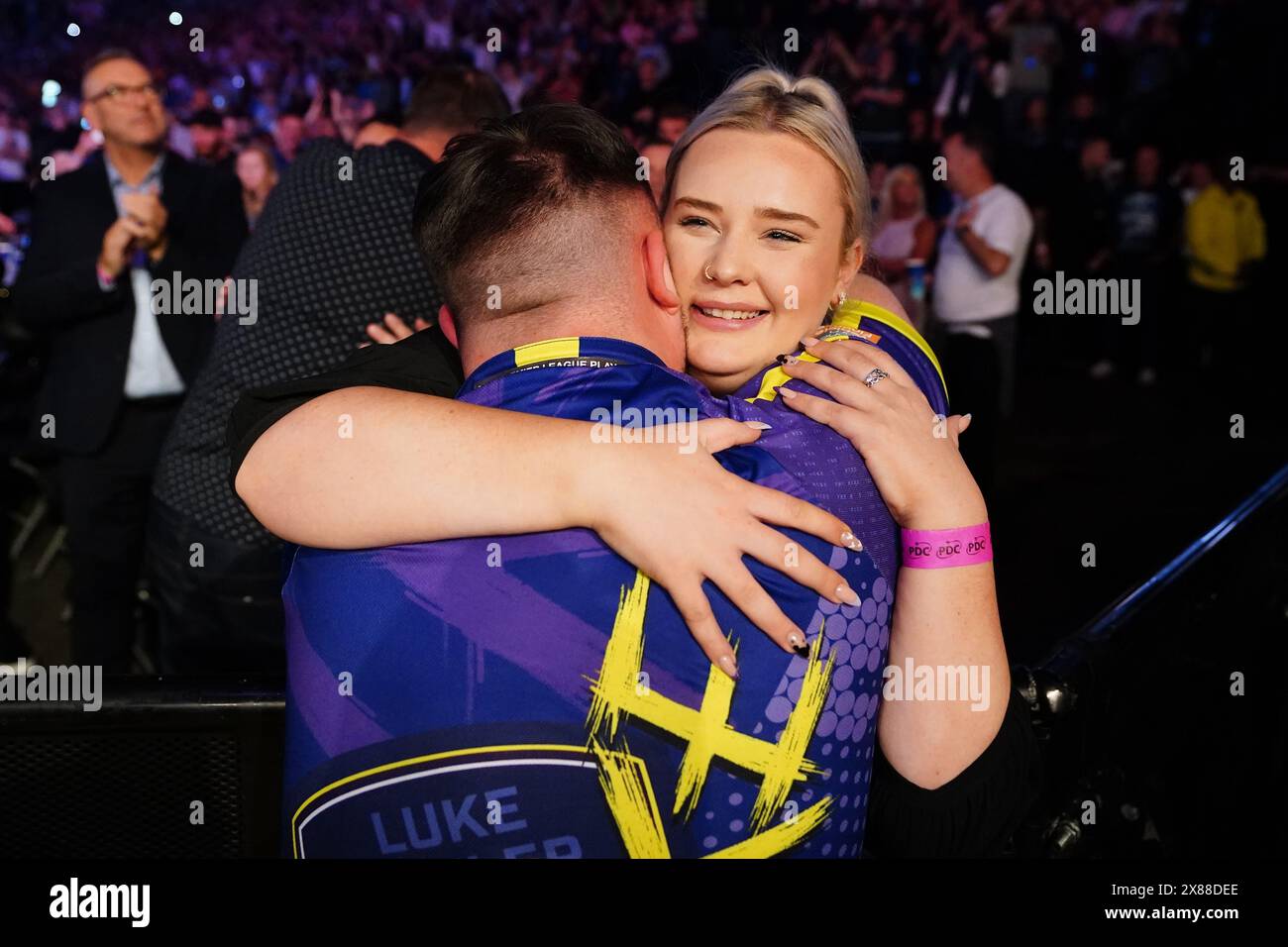 Luke Littler celebrates with his girlfriend Eloise Milburn after ...