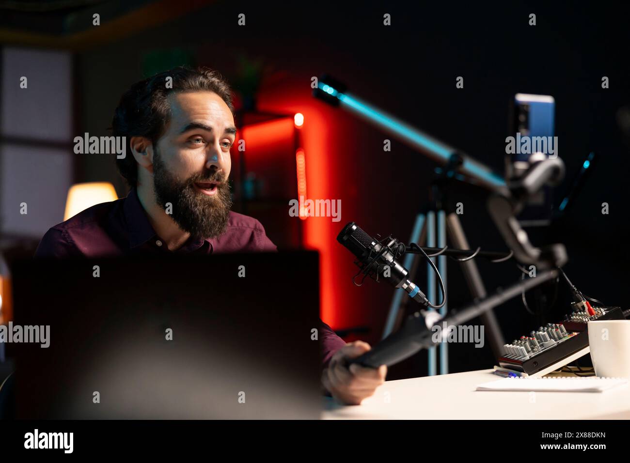 ASMR content creator using quality mic and cellphone on selfie stick to ...