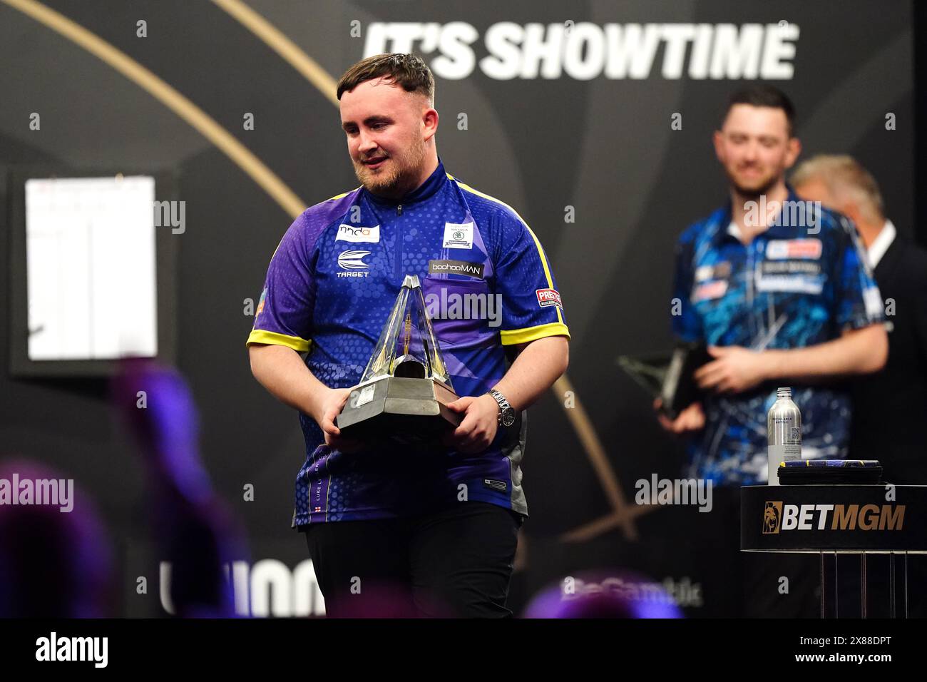 Luke Littler (left) with the trophy after victory as runner up Luke ...