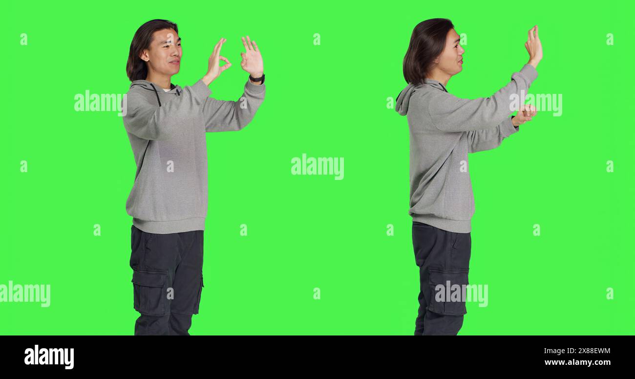 Young model showing okay symbol in studio, acting pleased and happy ...
