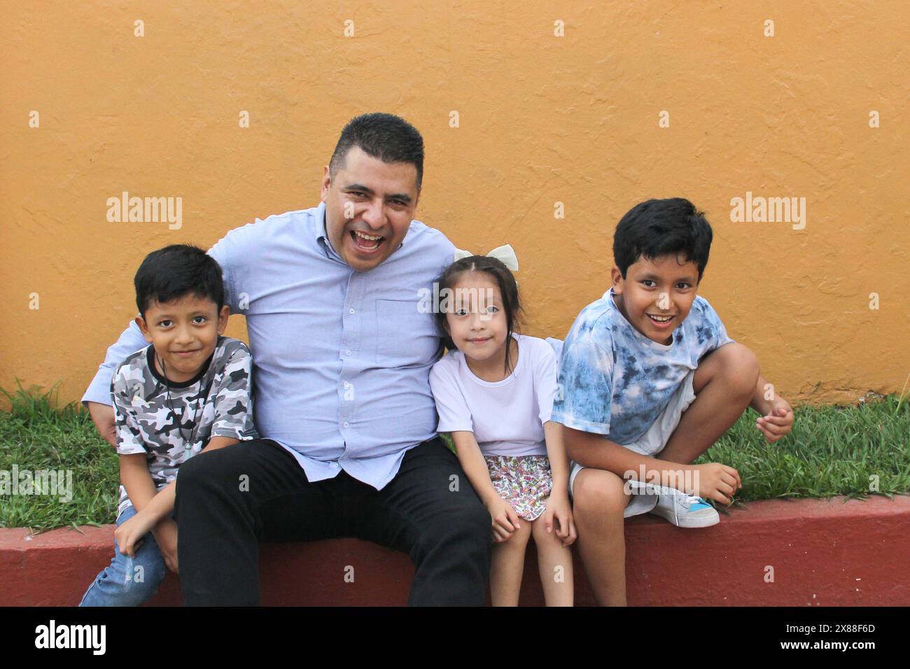 Divorced single dad has fun with his three dark-skinned Latino kids ...