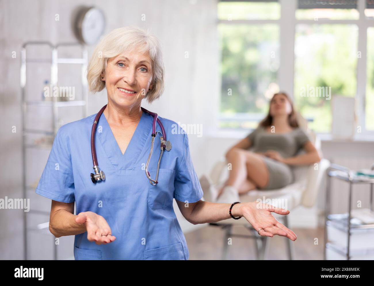elderly female doctor with stethoscope Stock Photo - Alamy