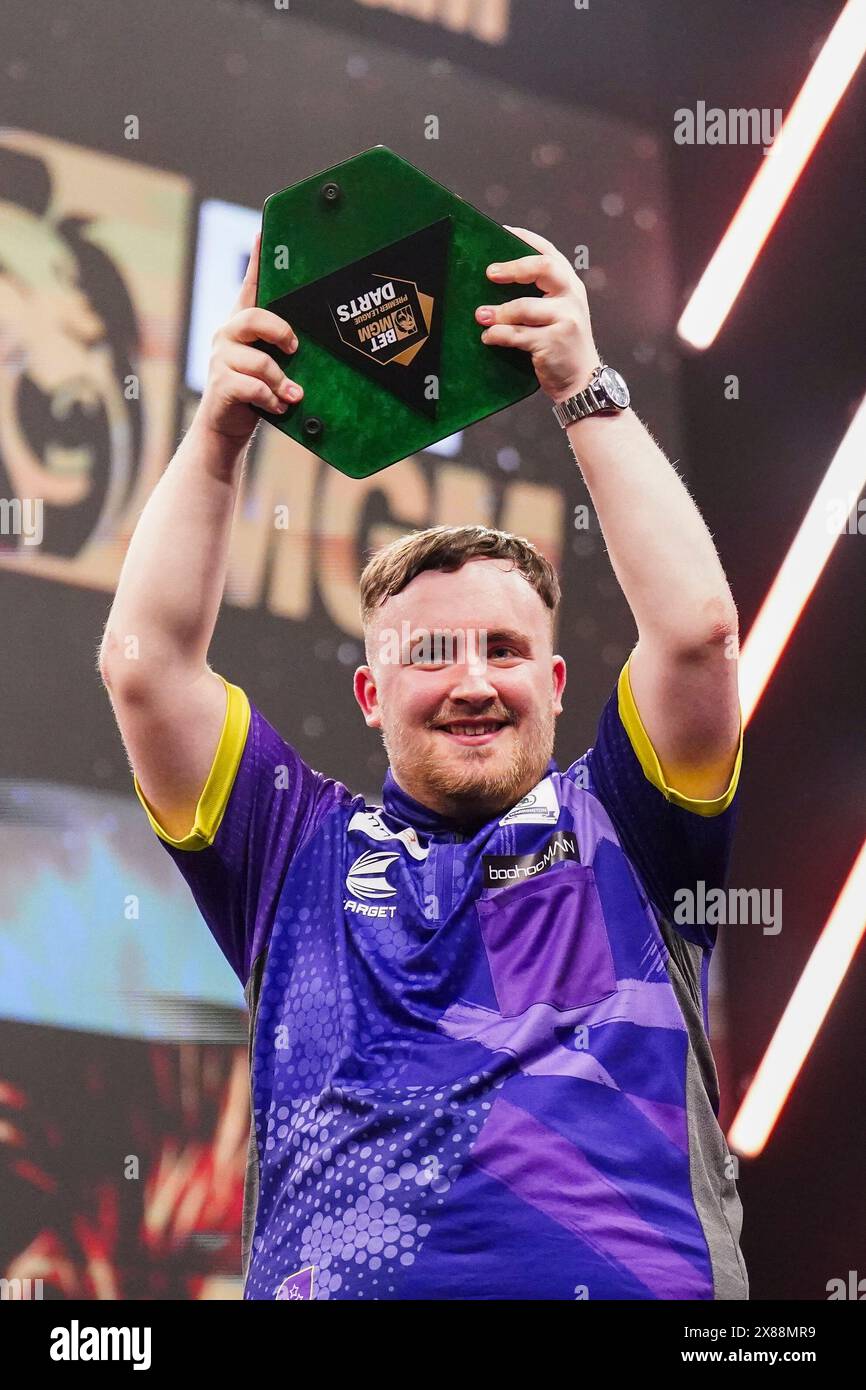 London, UK. 23rd May, 2024. Luke Littler lifts the trophy during the ...