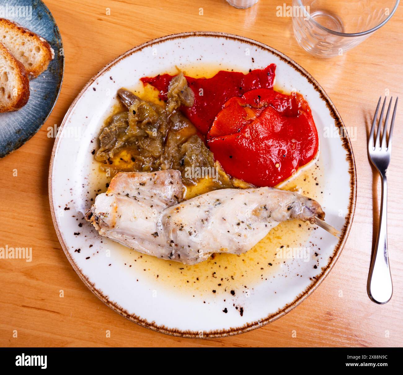 Roasted rabbit served with potato and vegetables Stock Photo - Alamy