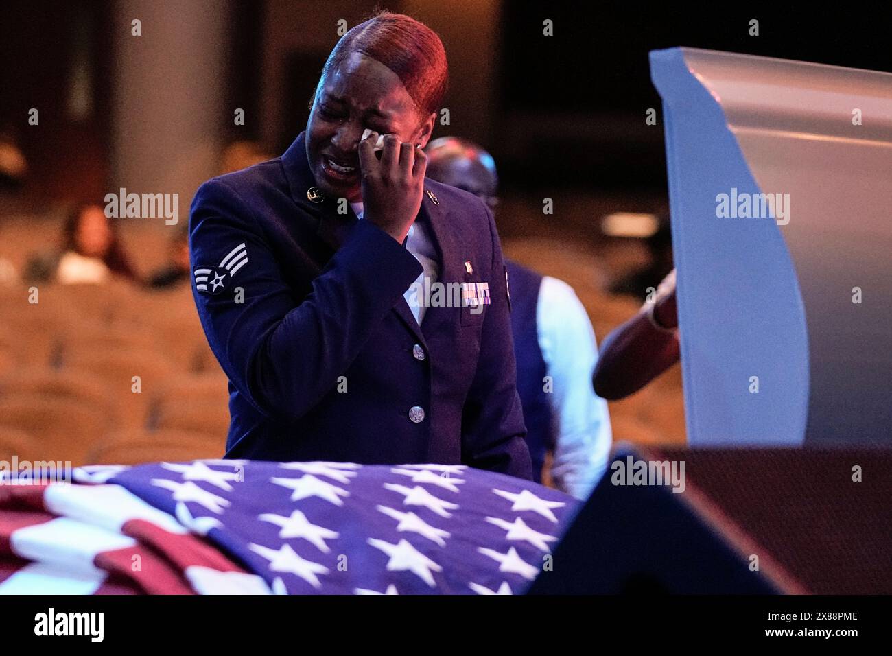U.S. Air Force personnel react at the coffin of slain airman Roger ...