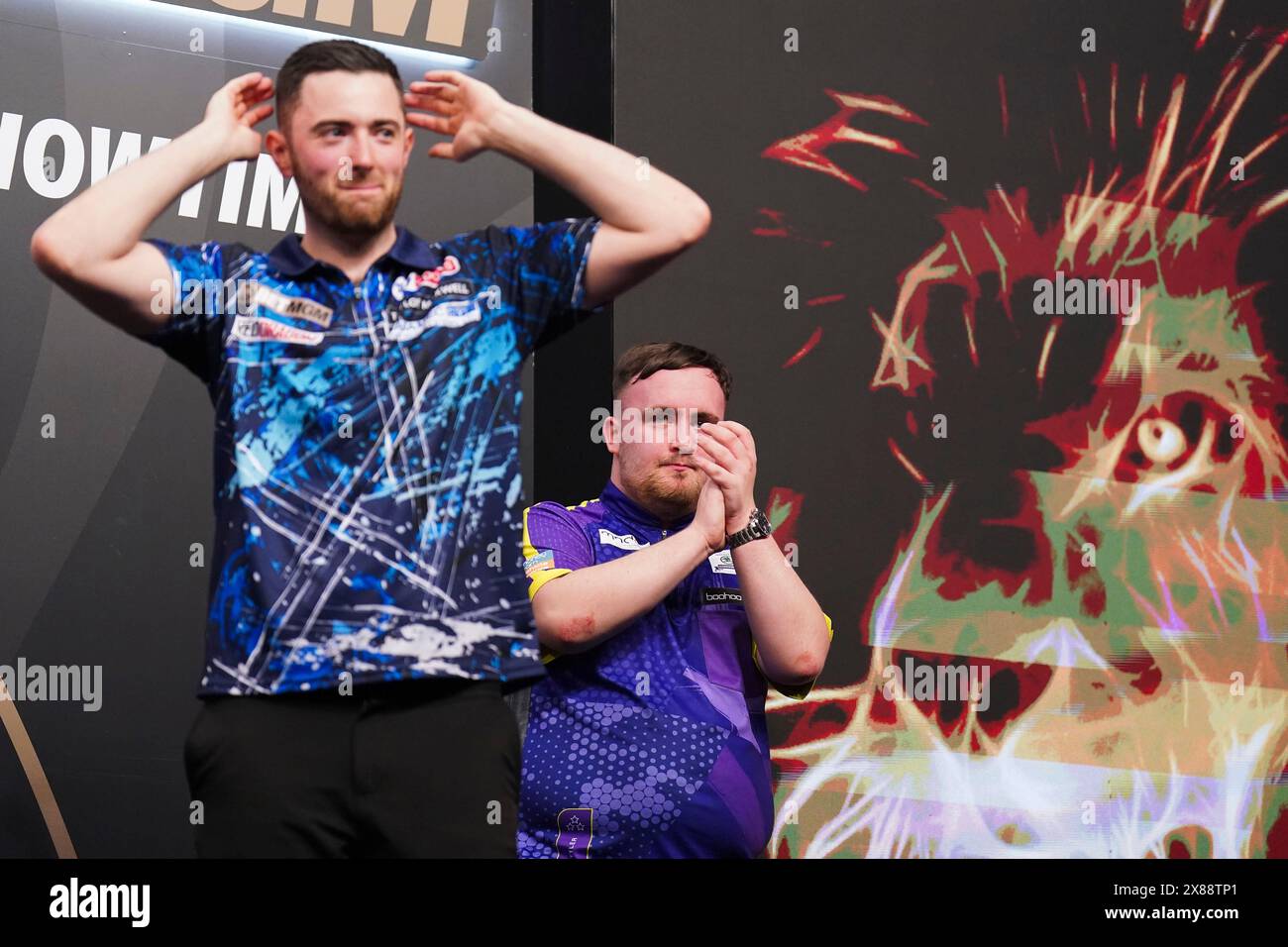 London, UK. 23rd May, 2024. Luke Littler watches on as Luke Humphries ...