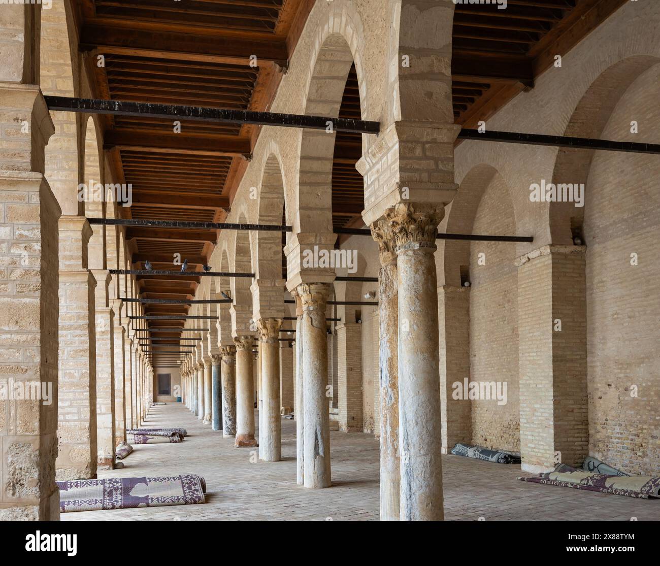 Riwaq with arches and columns around courtyard of Great Mosque of ...