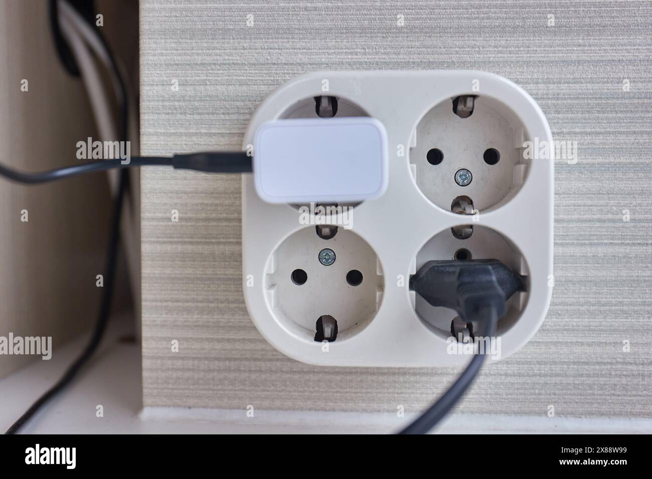 Electric sockets in the corner Stock Photo - Alamy