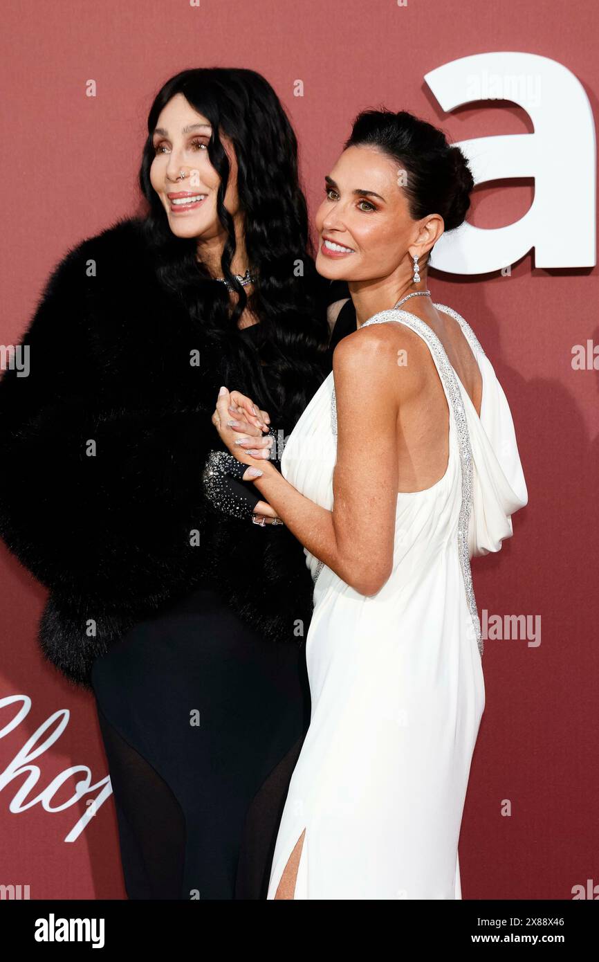 Cher and Demi Moore attend the amfAR Cannes Gala 2024 during the 77th ...