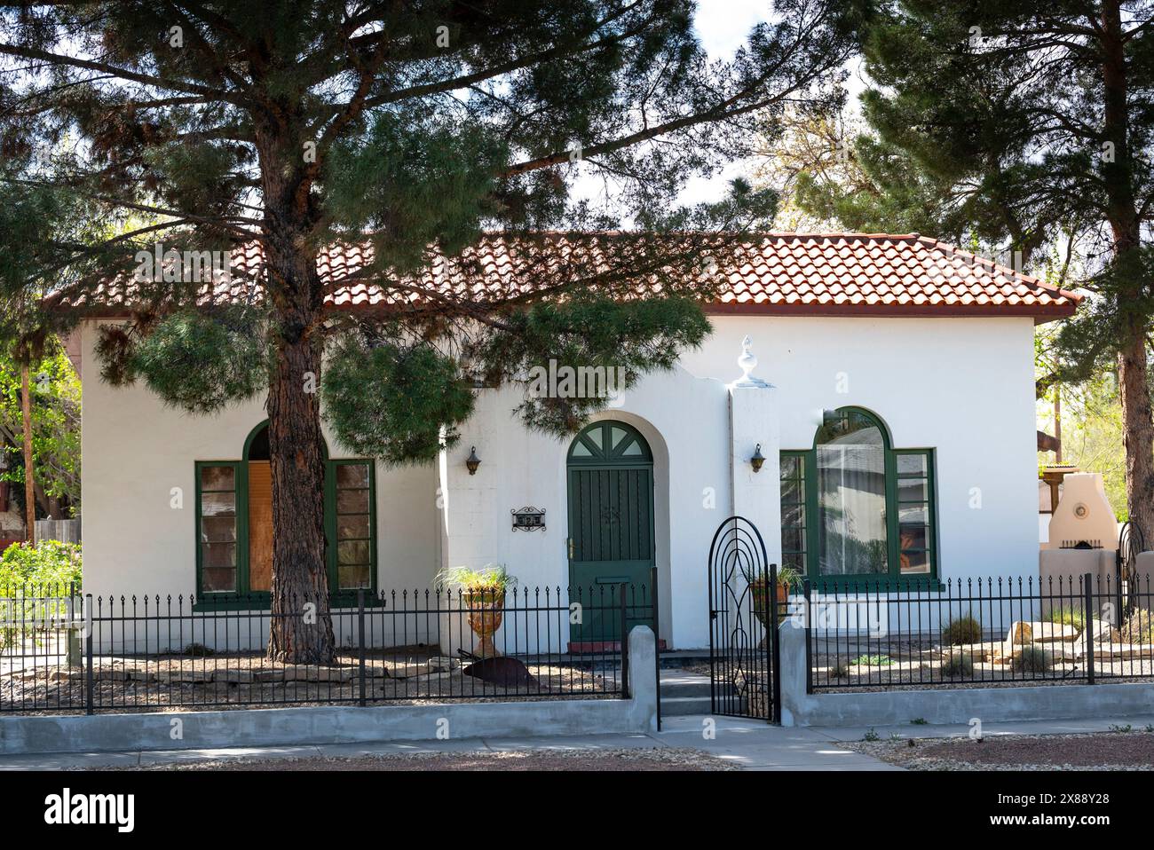 A charming and historic Spanish style white stucco home with red ...