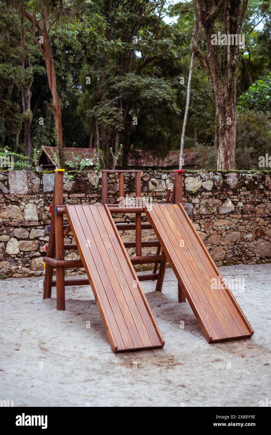 Captured in a lush tropical park, this children's playground features ...
