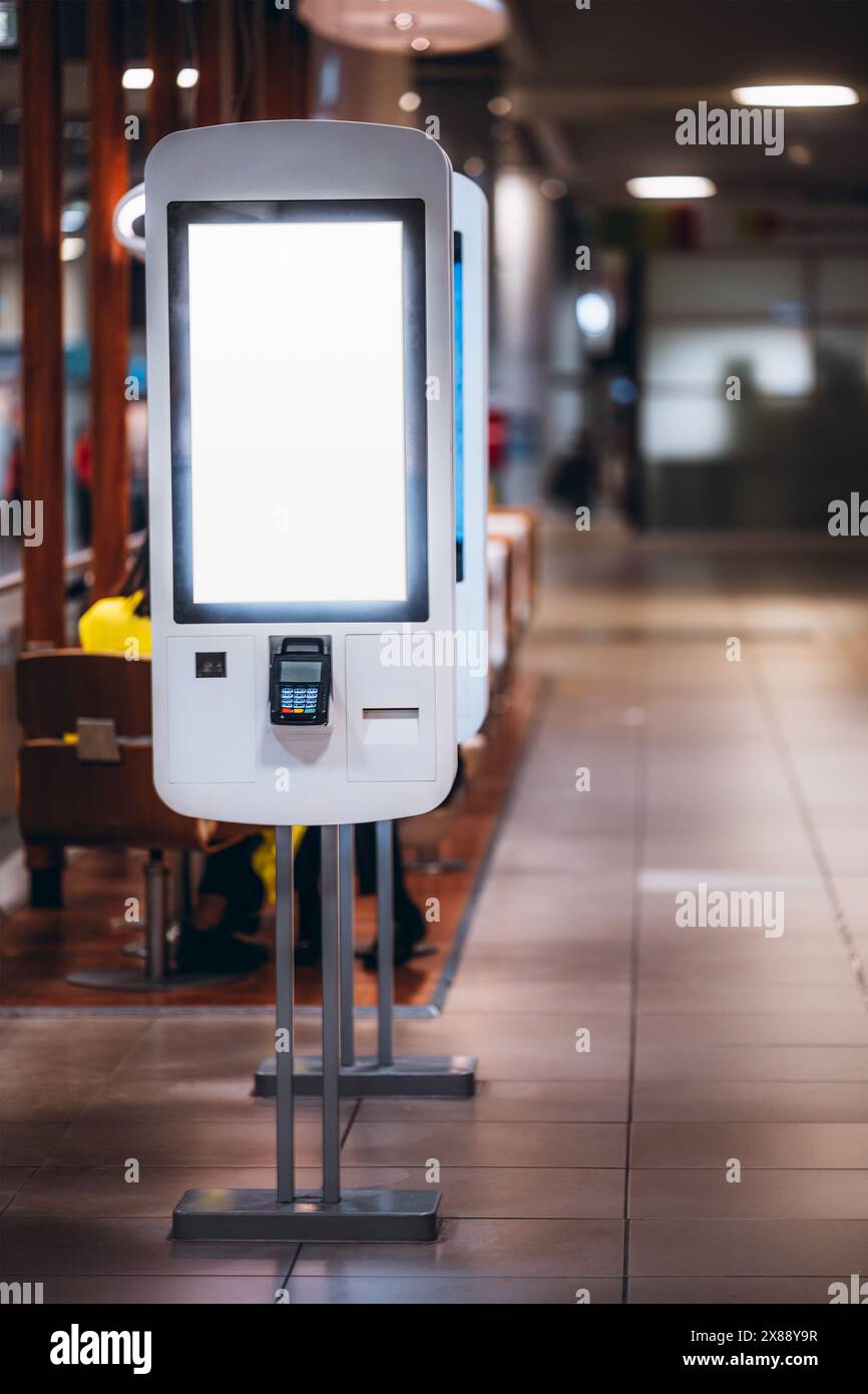Vertical view of a renowned fast-food chain's self-ordering kiosk mock ...