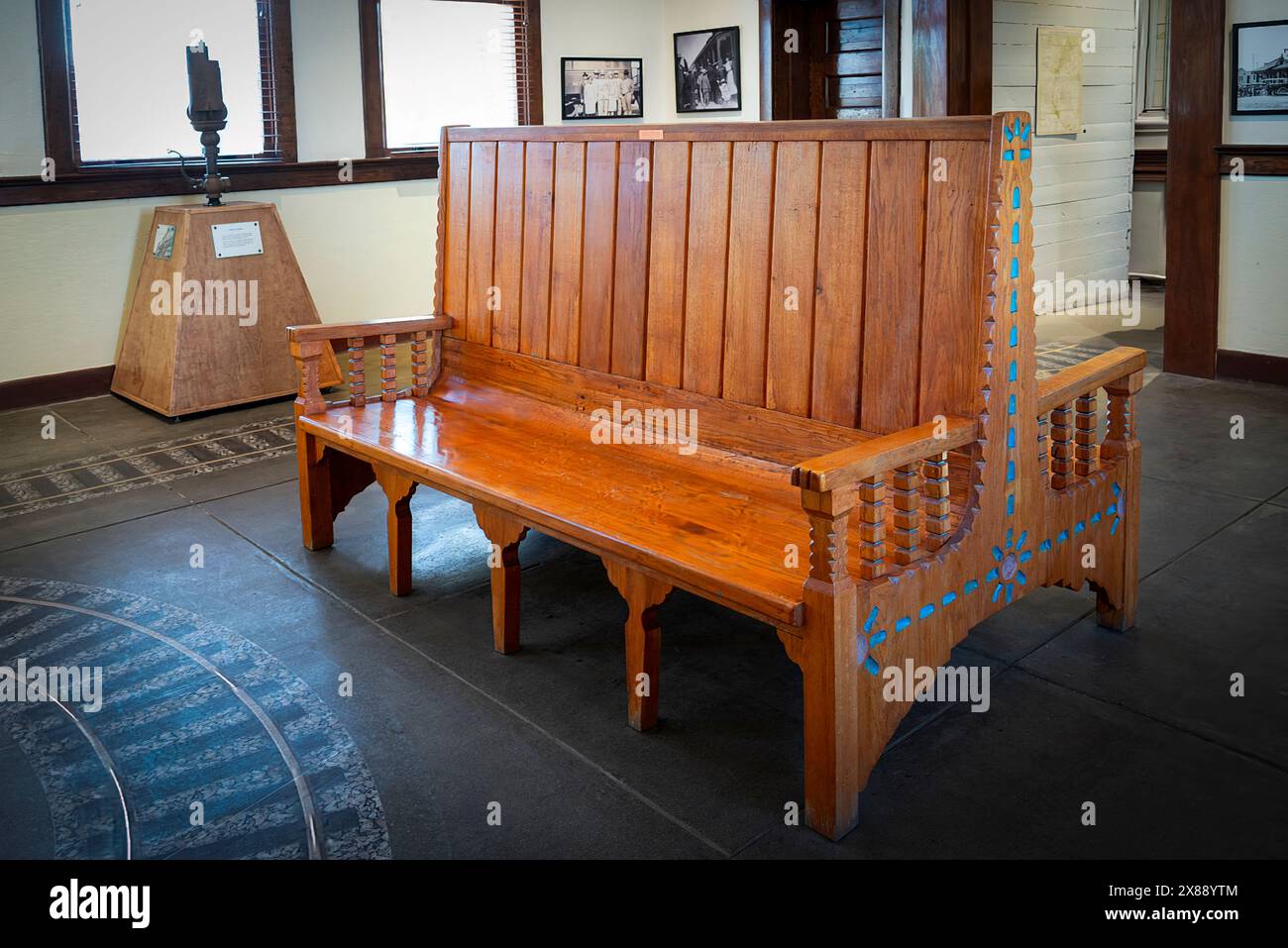 A beautiful New Mexican style wooden bench in the waiting room with ...