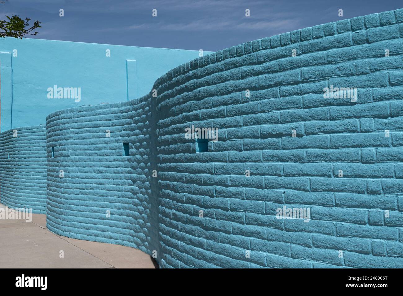 A eye dazzler of a wavy brick wall in turquoise blue which resonates ...