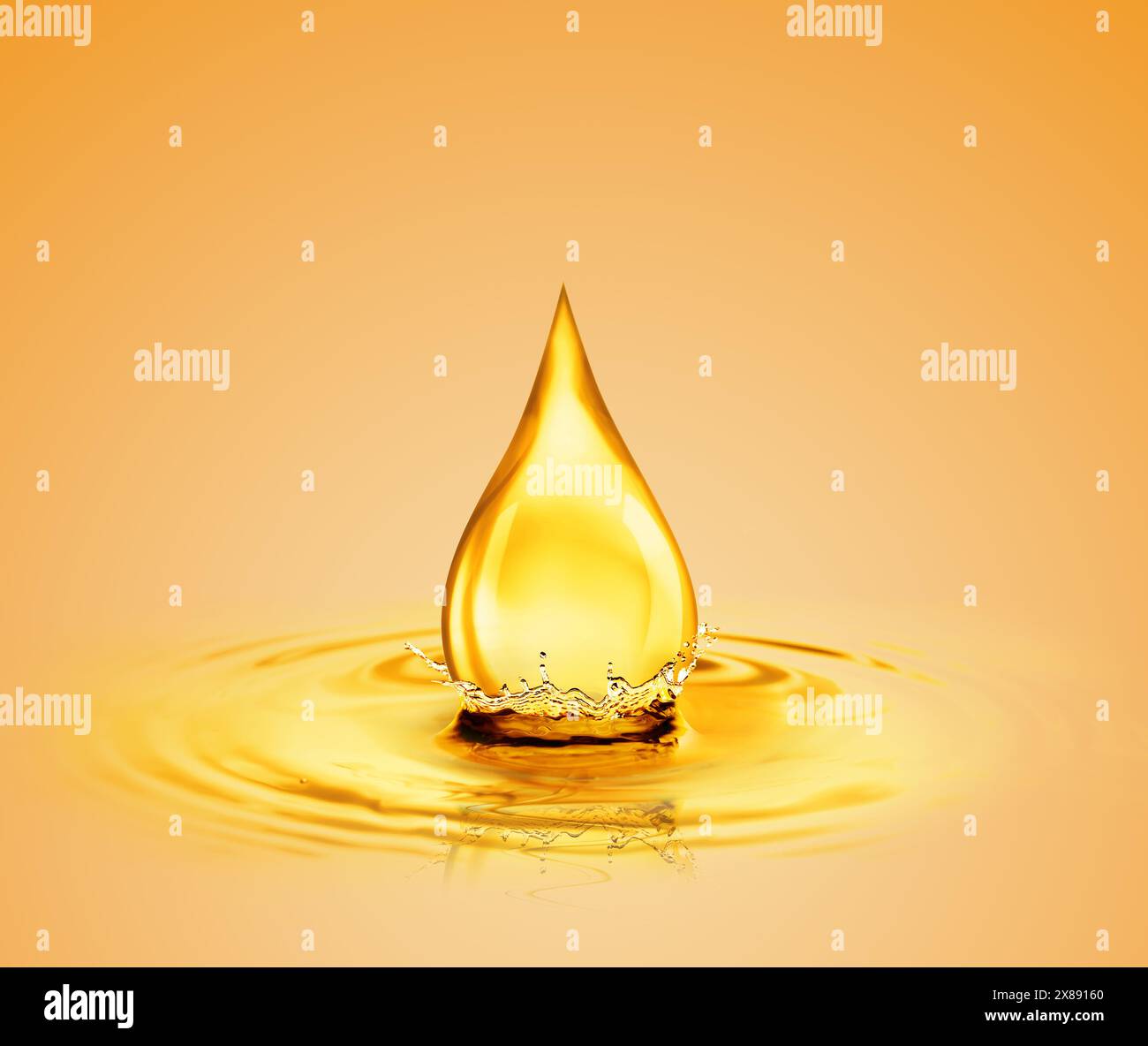 Drop of cooking oil falling into oil on orange background Stock Photo ...