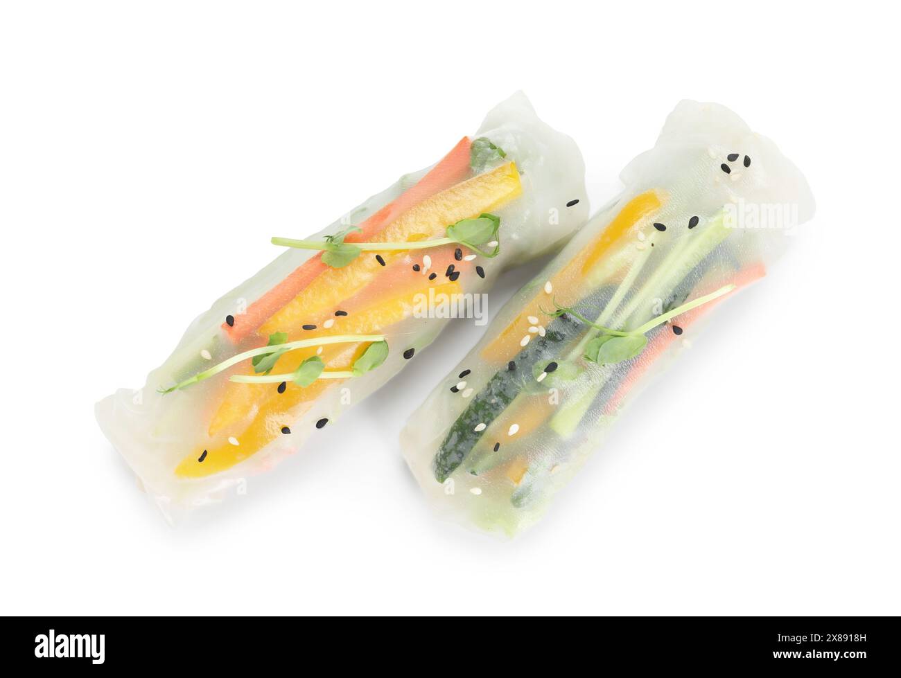 Tasty spring rolls with sesame seeds and microgreens isolated on white ...