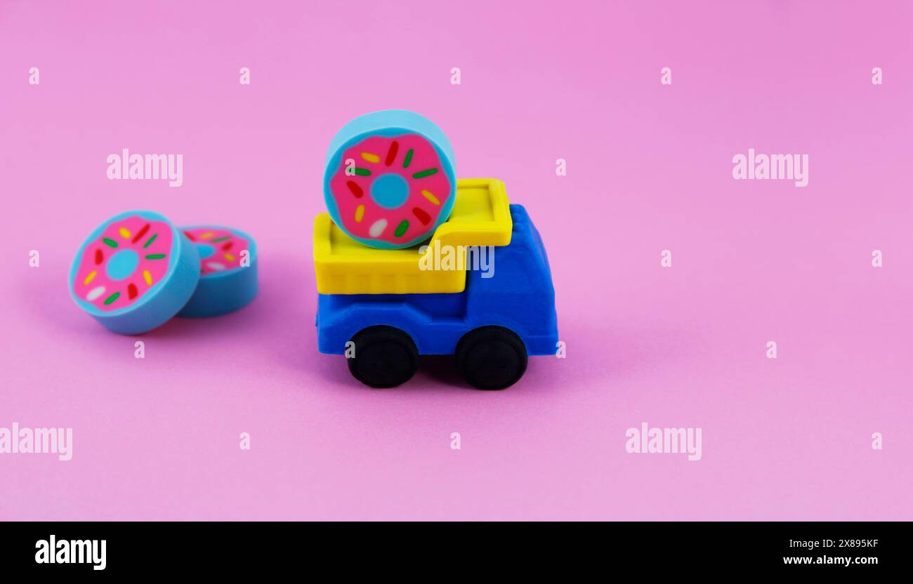 Erasers, truck carrying colorful donuts Stock Photo - Alamy