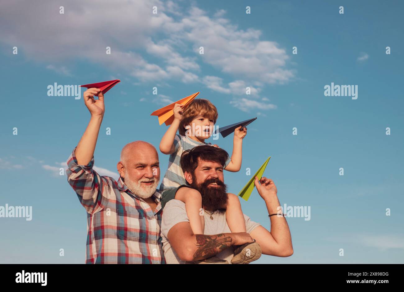 Three different generations ages: grandfather father and child son ...