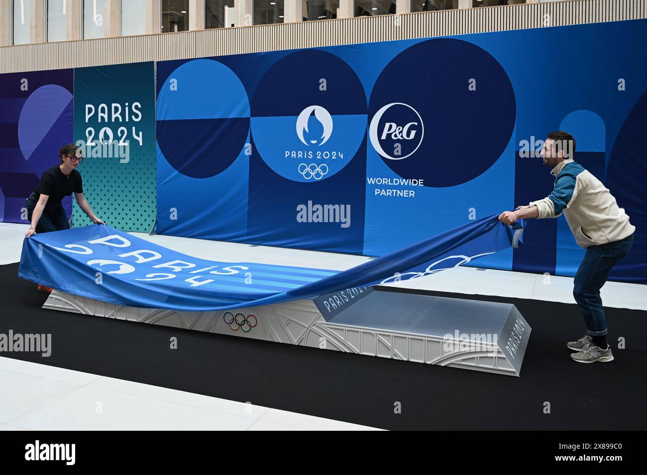 Saint Denis, France. 23rd May, 2024. Staff unveil the Paris 2024 podium ...