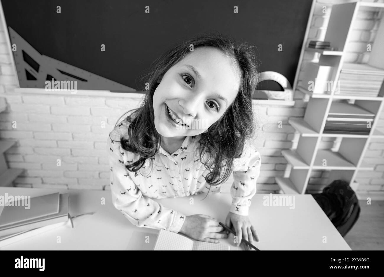 Funny child school girl pupil with fun glasses in classroom. Fun child ...