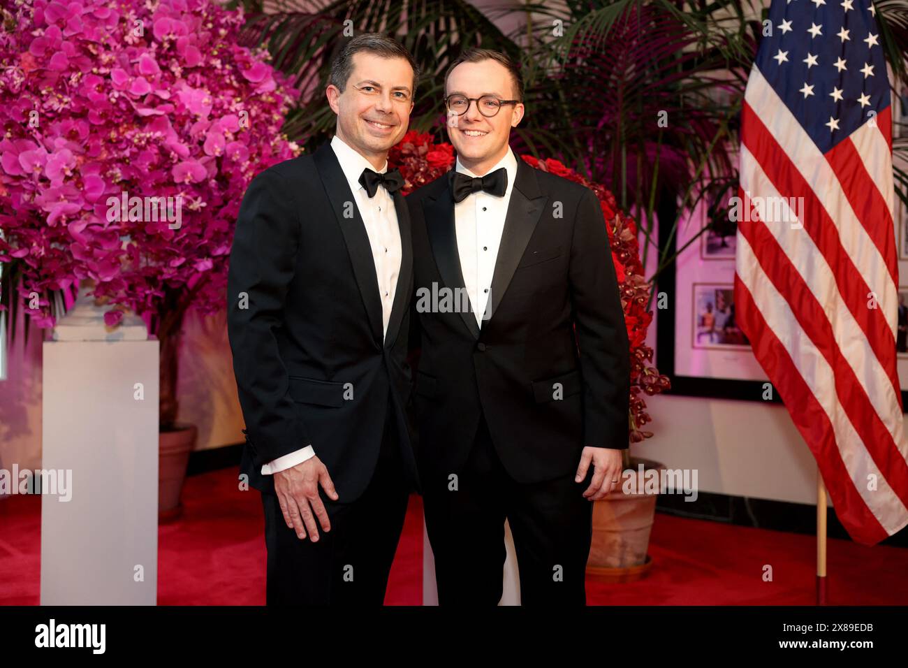 Pete Buttigieg, US secretary of transportation, left, and Chasten ...