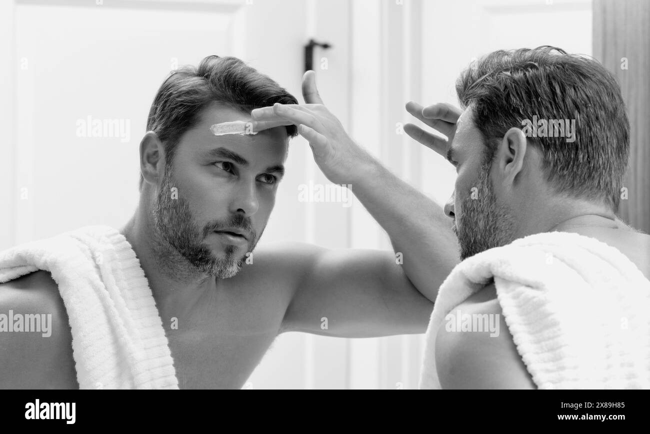 Beauty man use moisturizing face balm for healthy skin, male skincare ...