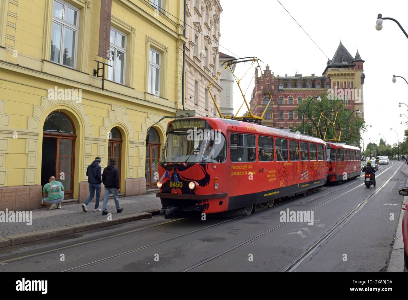 A vintage Prague tram passing the historic Colloredo-Mansfeld Palace ...