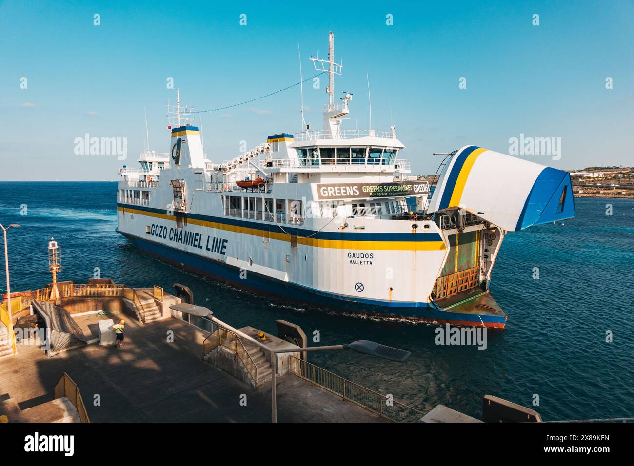 The Gozo Channel Line ferry comes into port with a raised bow, carrying ...