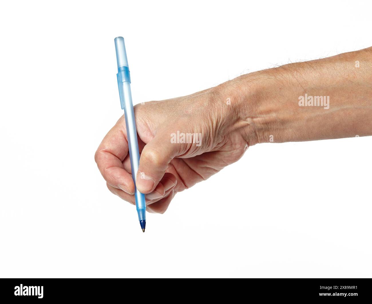 Male hand holding a pen isolated on white background. Man writes with a ...