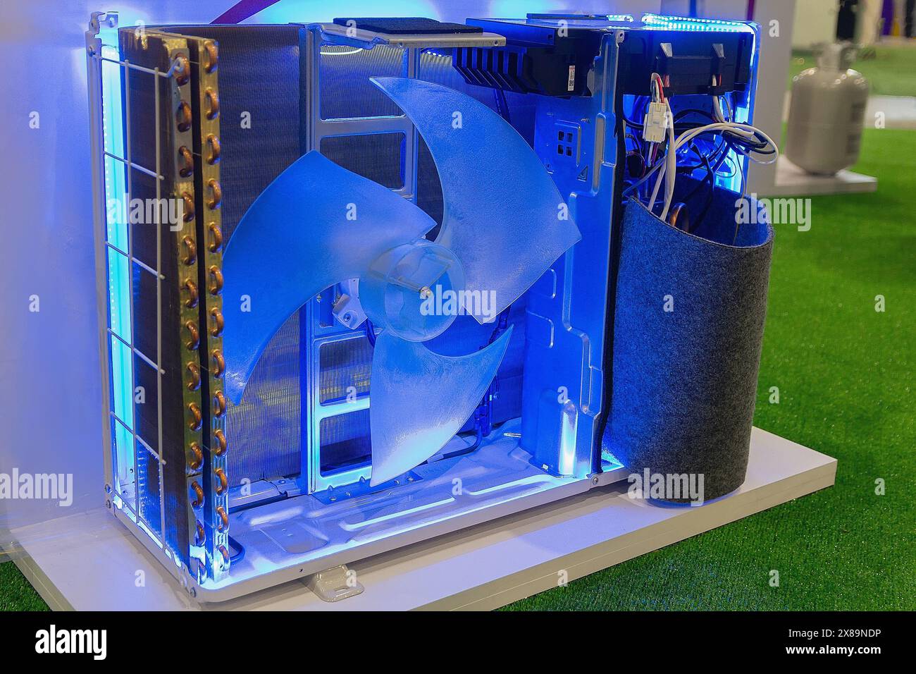 The insides of an external air conditioner unit on a stand in a store ...