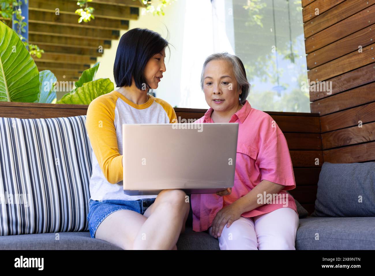 At home, Asian middle-aged mother and young adult daughter studying laptop Stock Photo - Alamy