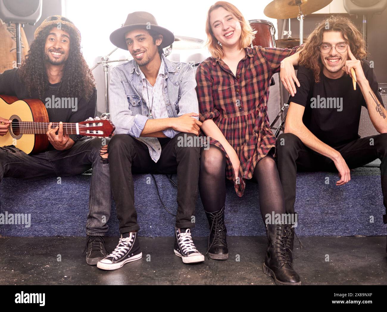 Portrait, people and band of musician on stage for practice ...