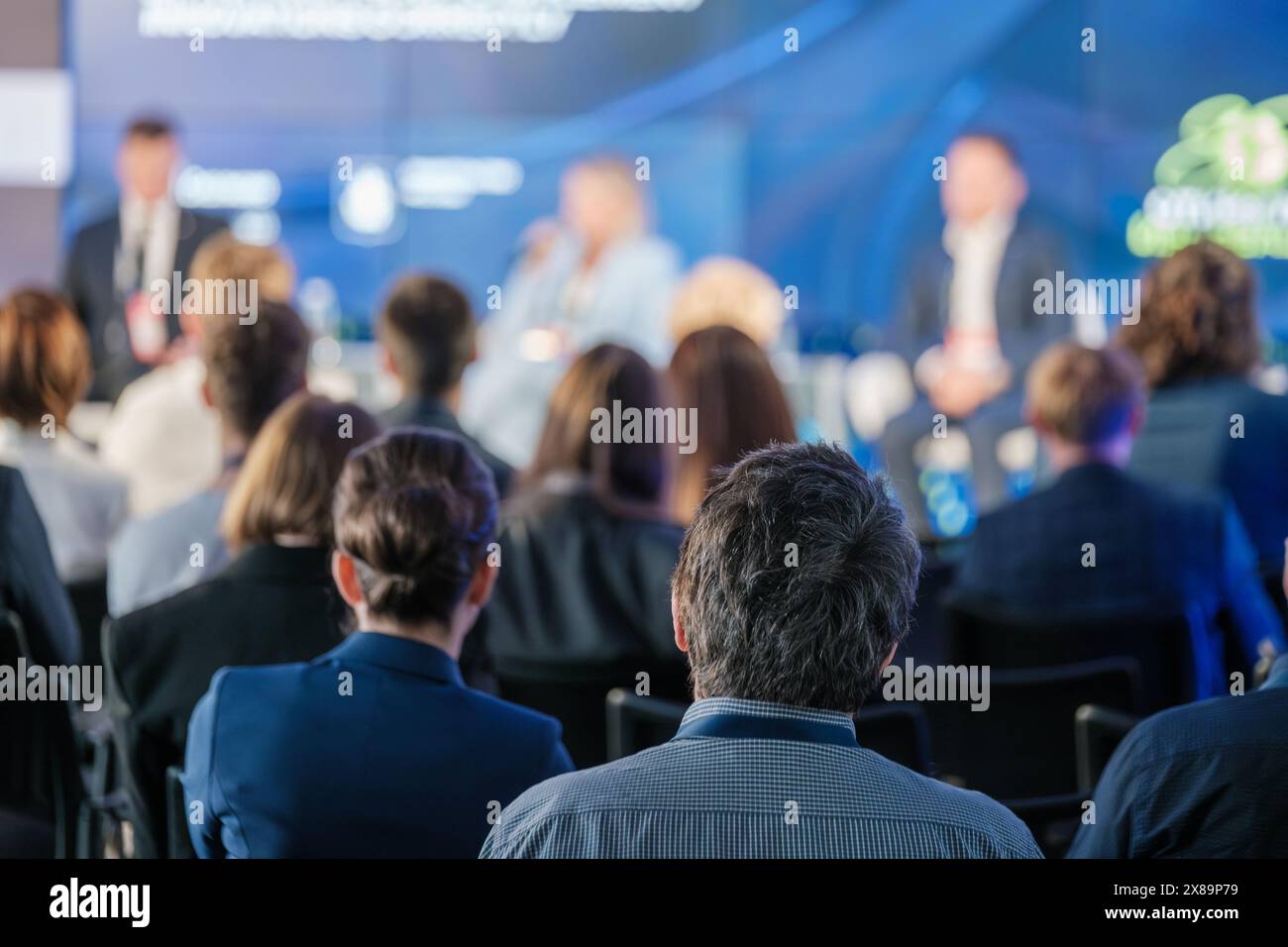 Attendees focus on professional panel hi-res stock photography and ...