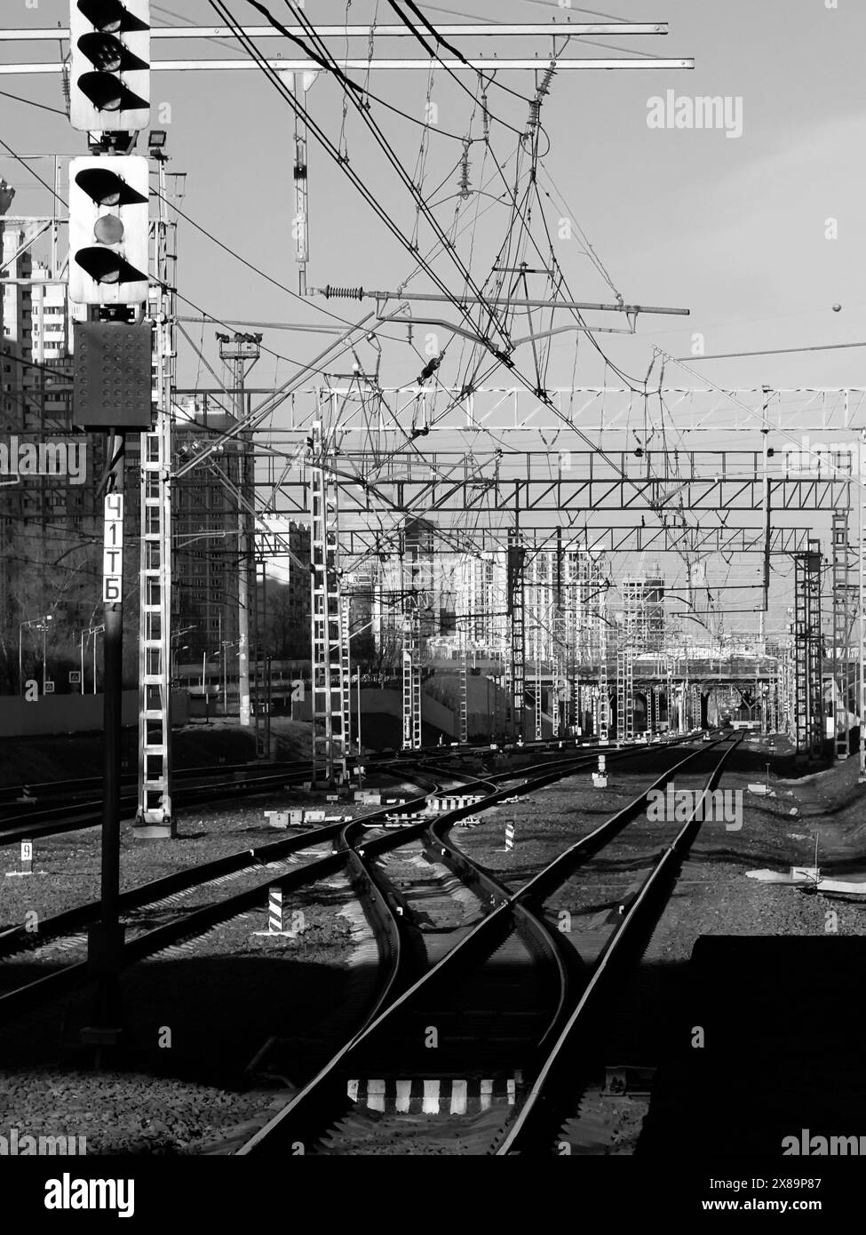 Black and white photograph of urban railway tracks with complex ...