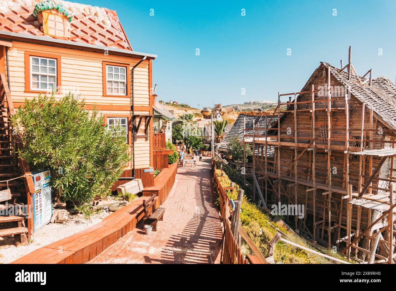 The main pathway through wooden buildings of Popeye Village, a movie ...