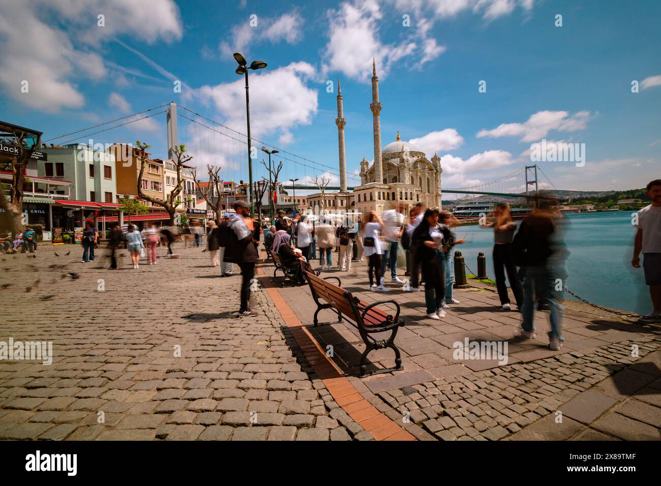 Ortakoy Mosque and tourists. Visit Istanbul concept photo. Istanbul ...