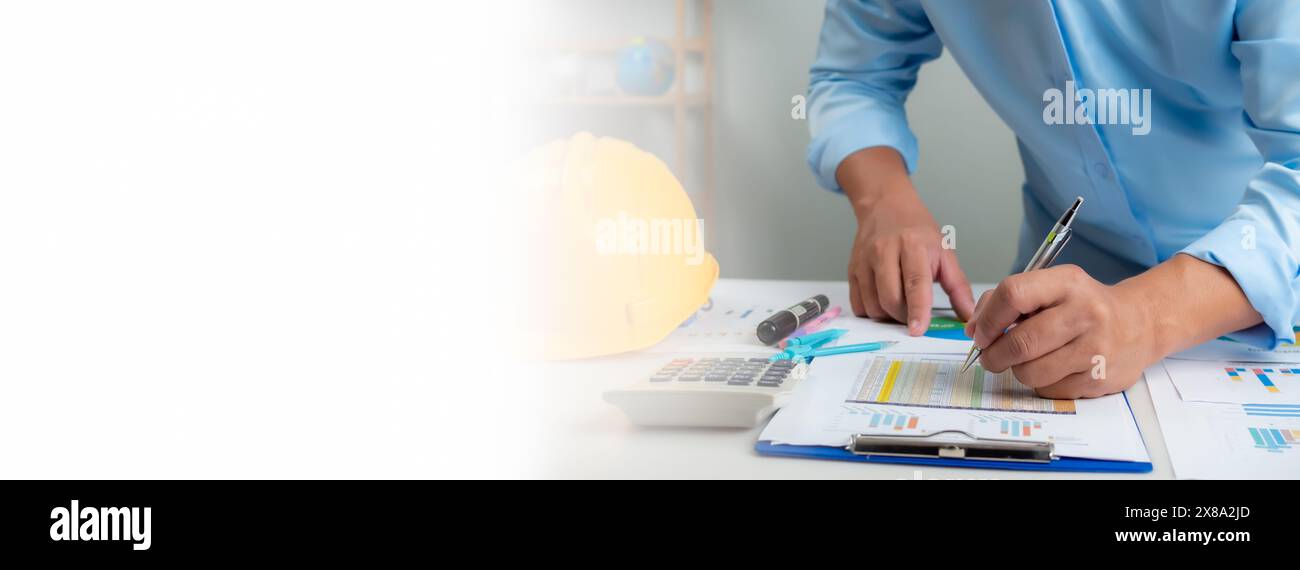 Architect or engineer sitting at desk in office, Cost calculation ...