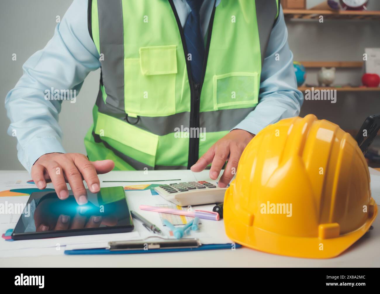 Architect Or Engineer Using Tablet To Work On Table Cost Calculation Construction Planning