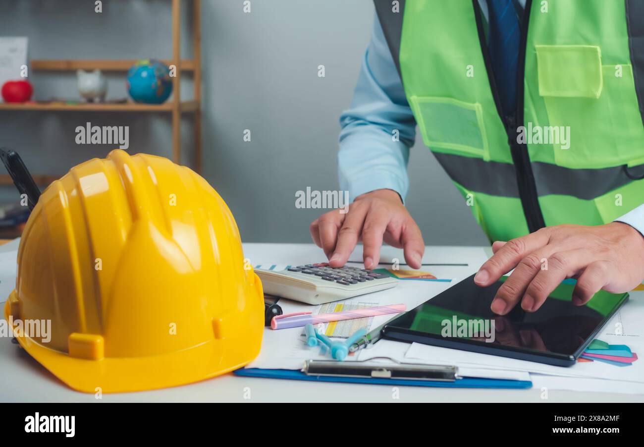 Architect Or Engineer Using Tablet To Work On Table Cost Calculation Construction Planning