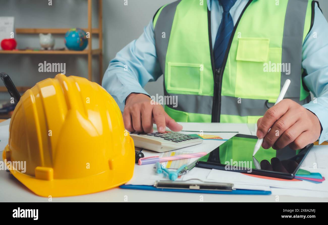 Architect Or Engineer Using Tablet To Work On Table Cost Calculation Construction Planning