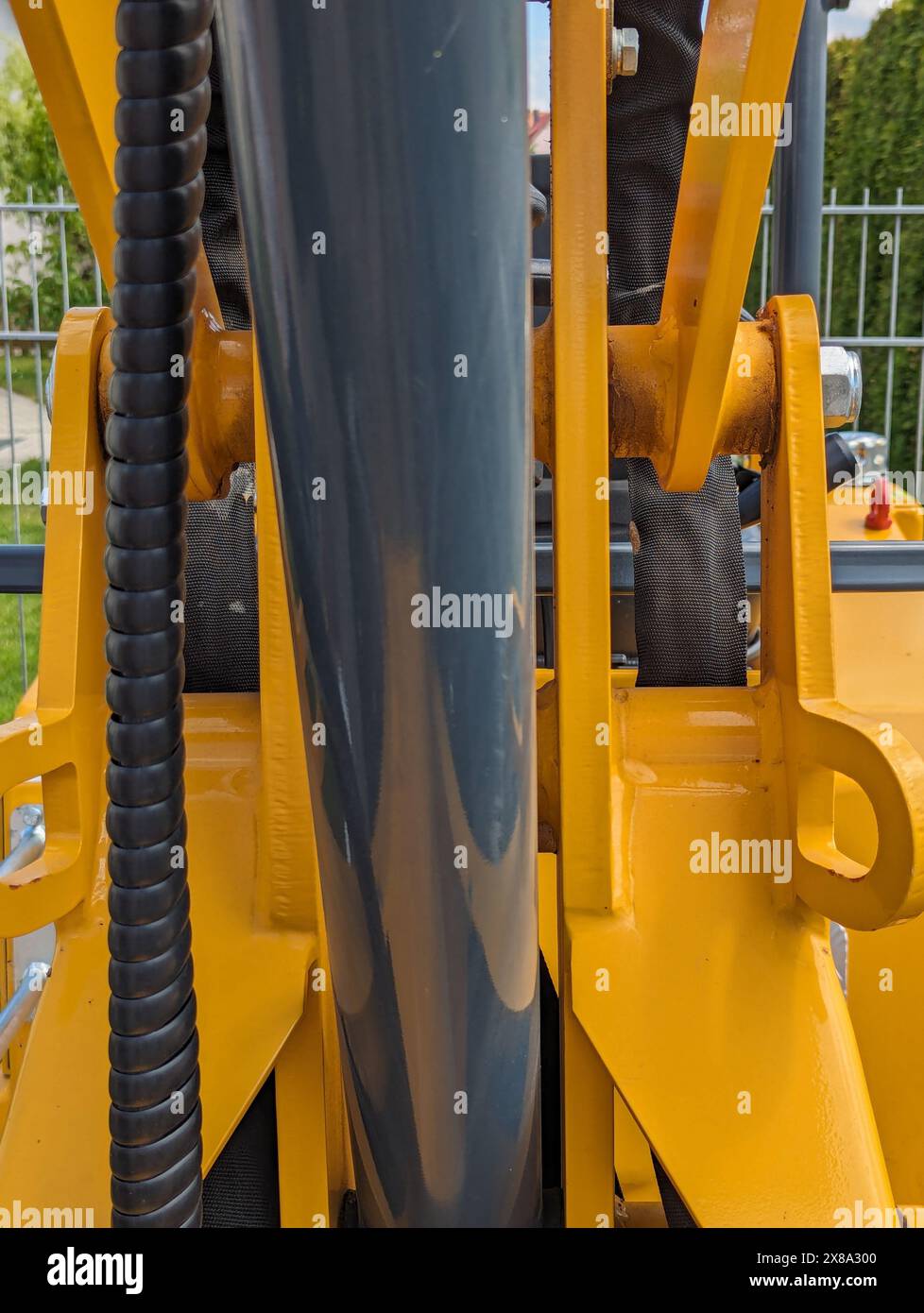 Yellow bulldozer arm, hydraulics tube Stock Photo - Alamy