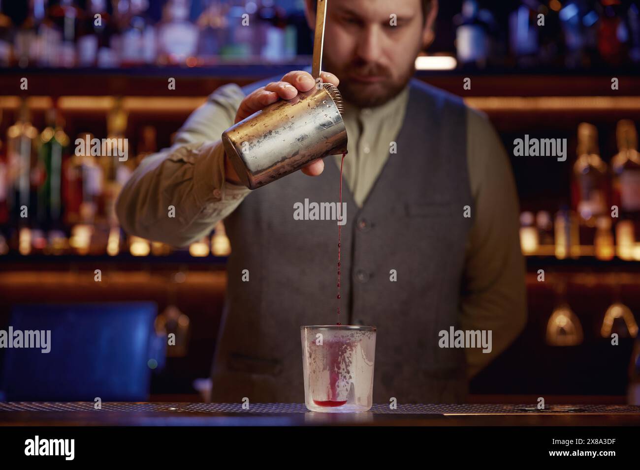 Serious barman work pouring alcohol hi-res stock photography and images ...