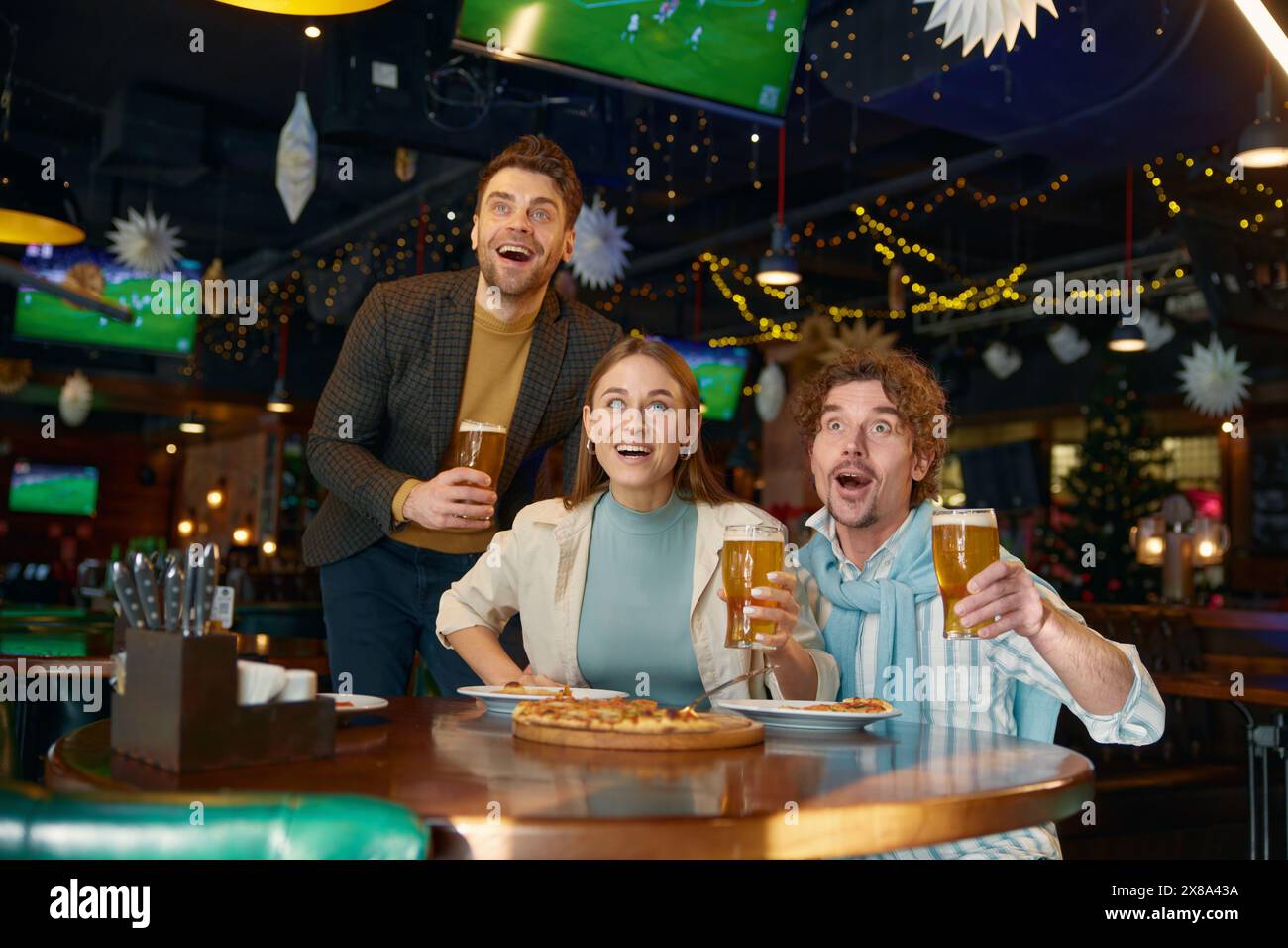 Excited friends crazy screaming supporting soccer team watching match ...